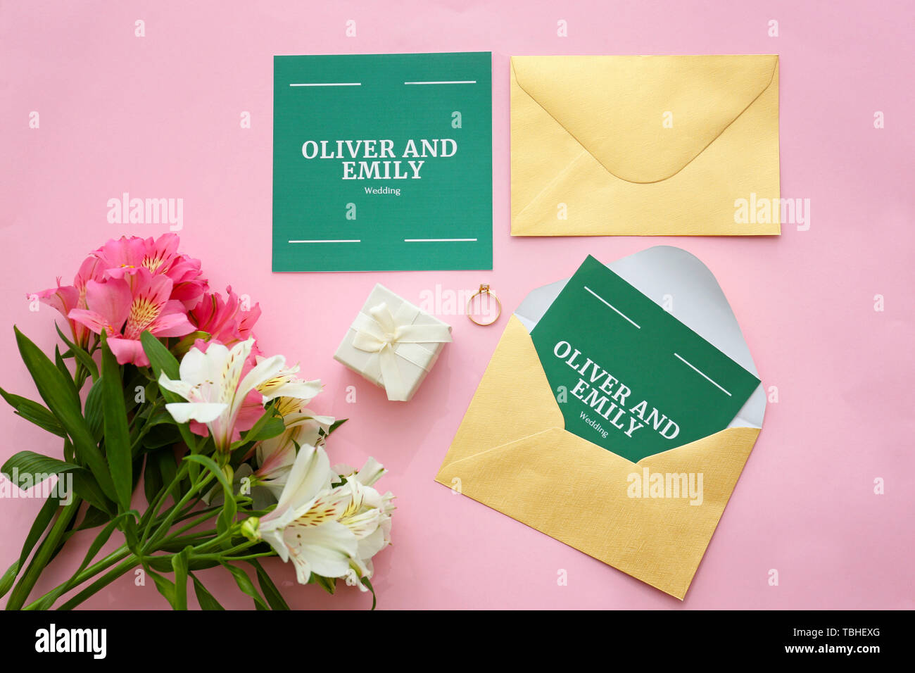 Wedding invitations on color background Stock Photo - Alamy