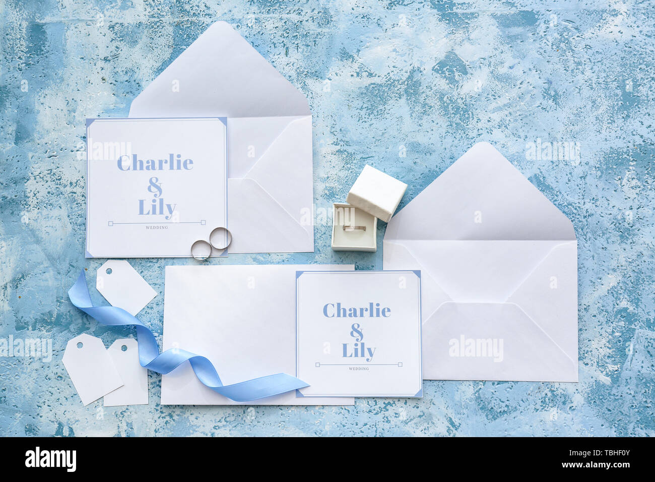 Wedding invitations on color background Stock Photo - Alamy