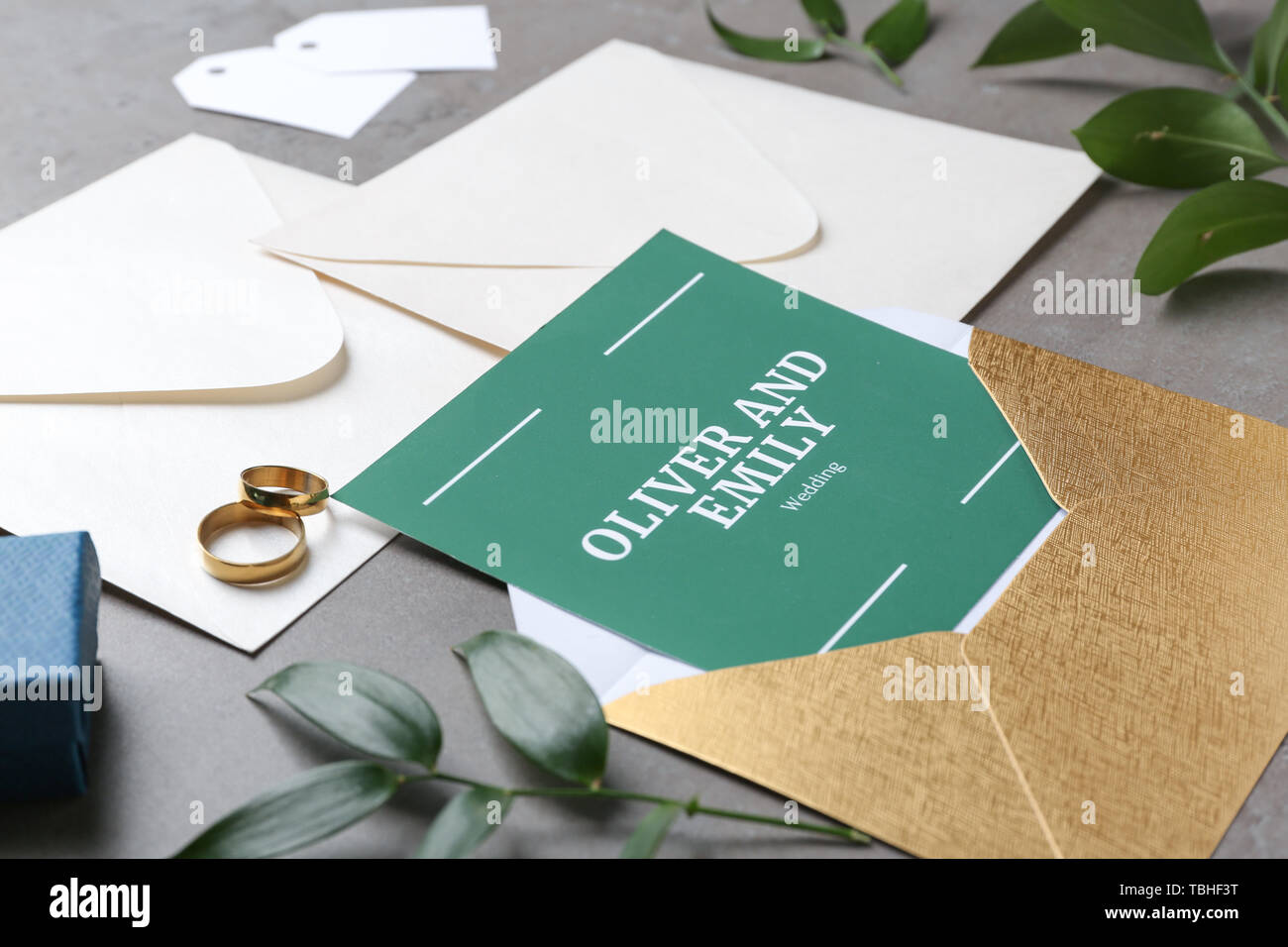 Wedding invitation on grey background Stock Photo - Alamy