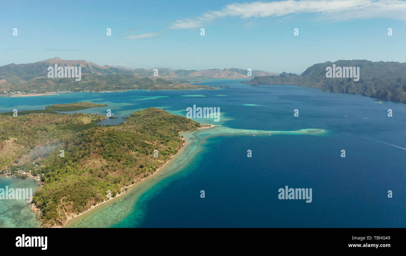 aerial view tropical islands with blue lagoons, coral reef and sandy ...