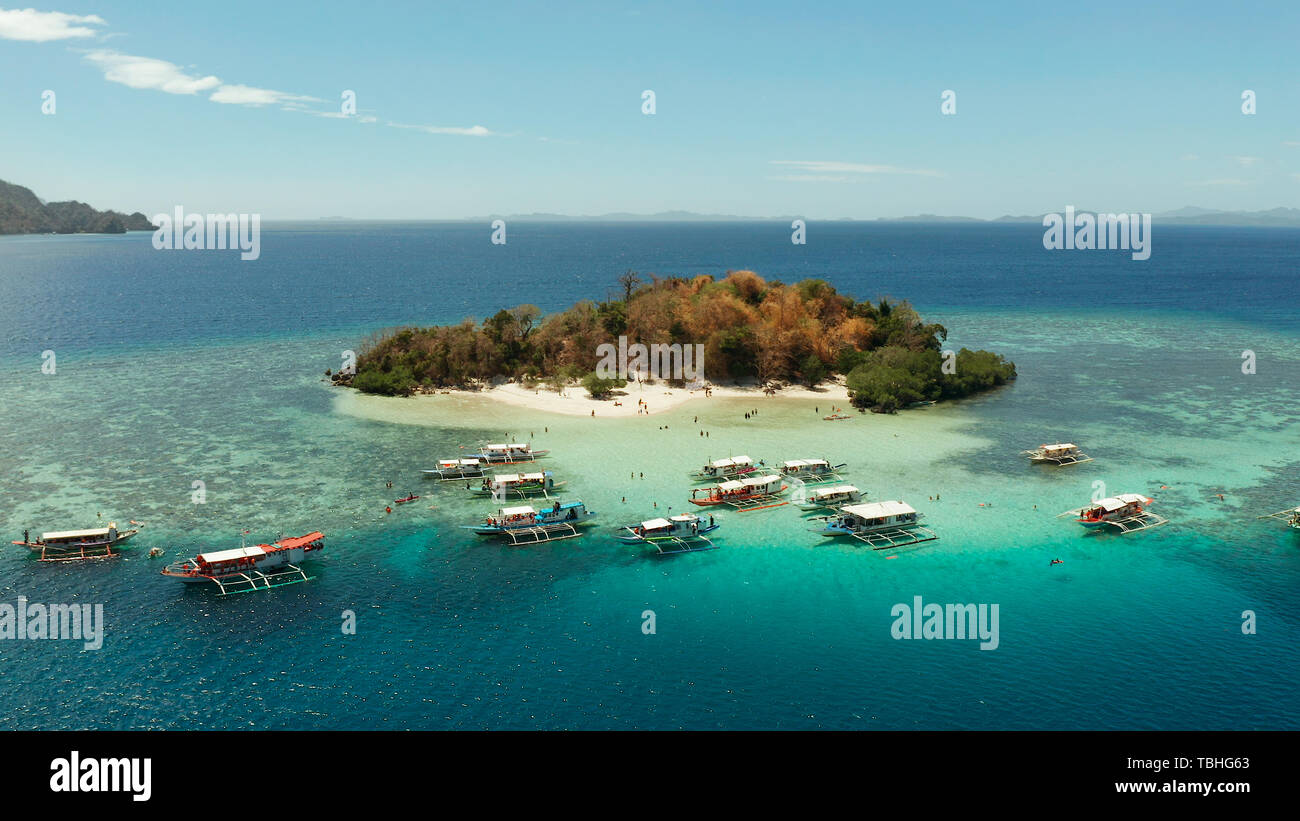 aerial view tropical island with sand white beach, clear and blue water ...