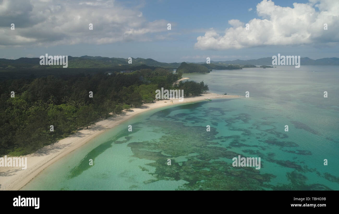 Aerial view of beautiful tropical beach with turquoise water in blue ...