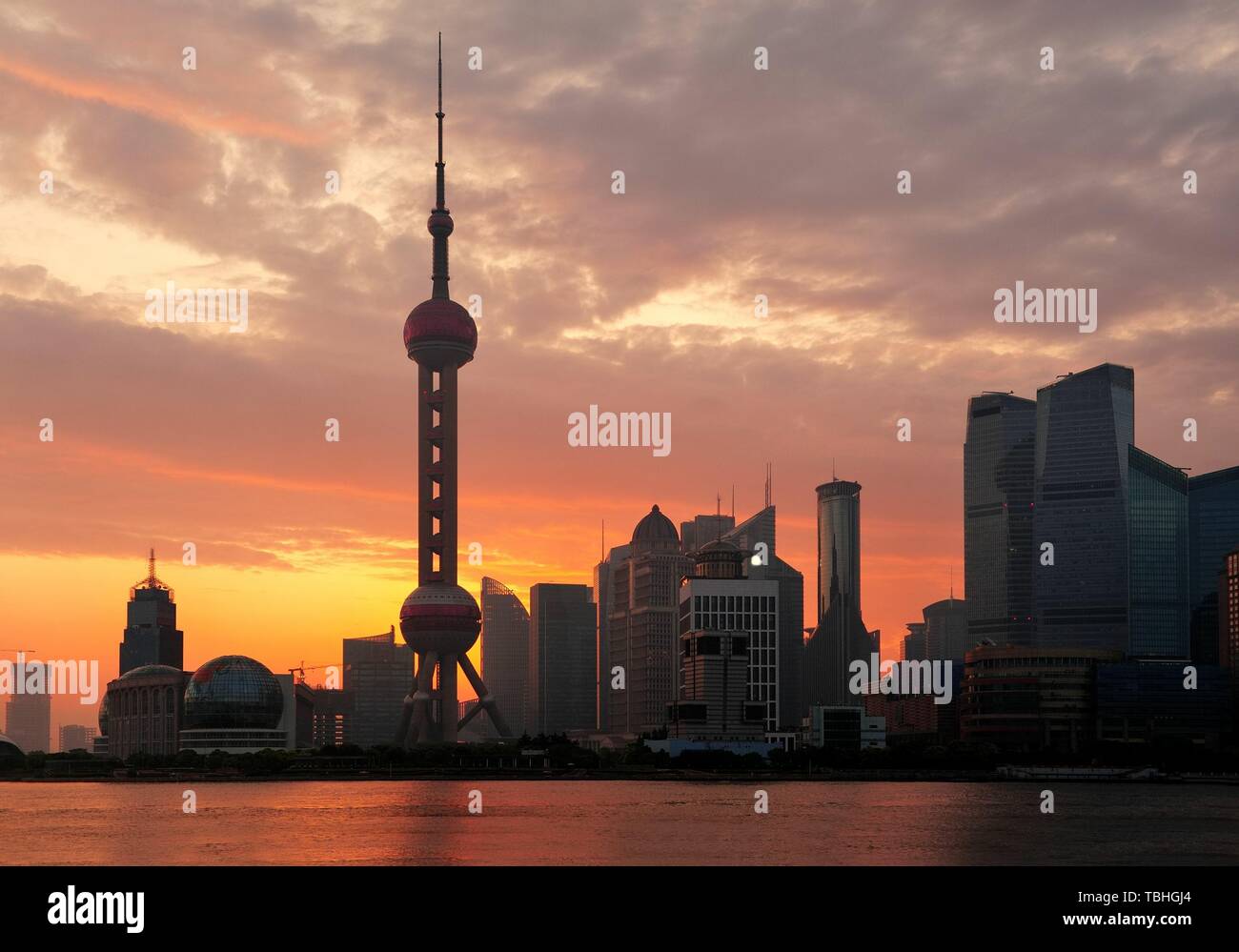 Shanghai morning city skyline silhouette over river with sunrise and ...