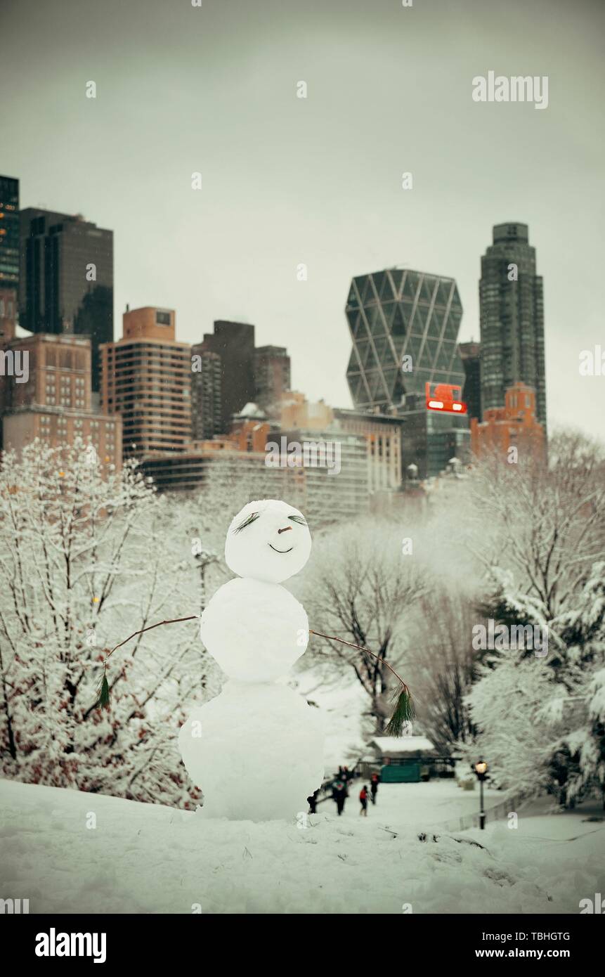 Snowman in Central Park winter with skyscrapers in midtown Manhattan ...