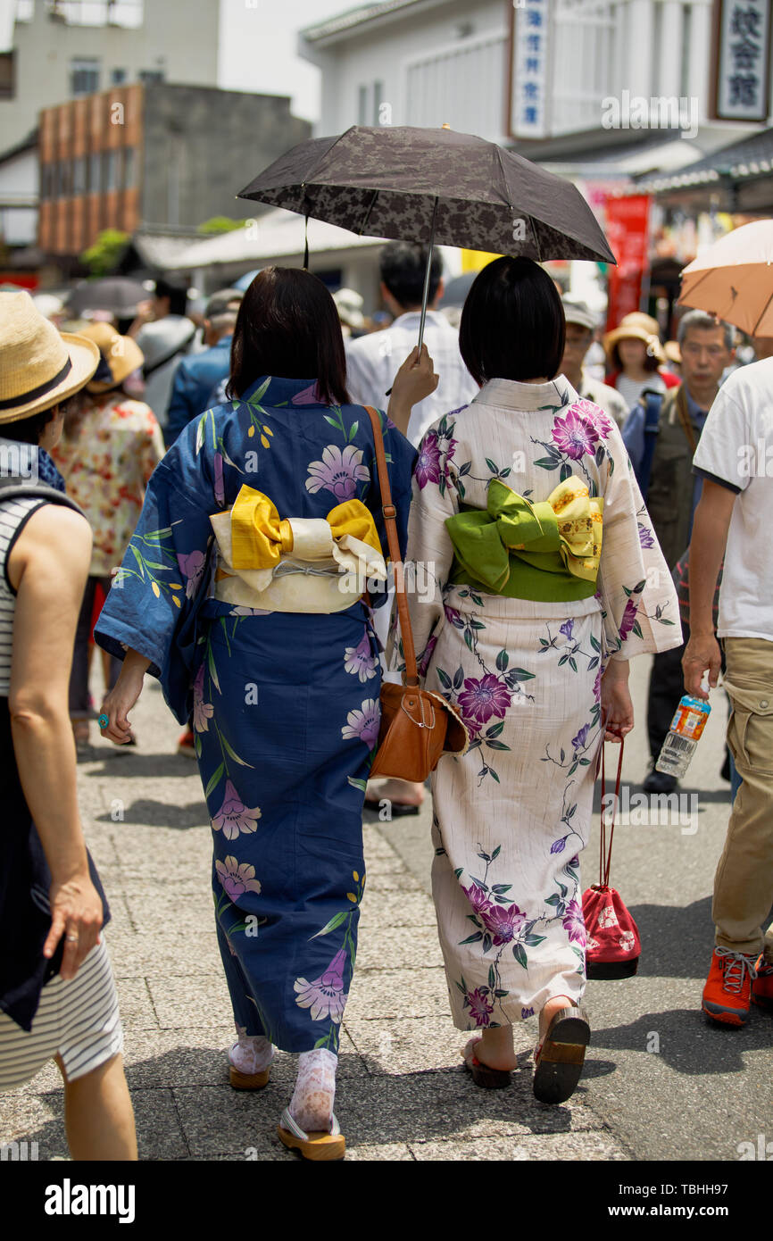 Women dressed in traditional Yukata costumes during a festival in ...