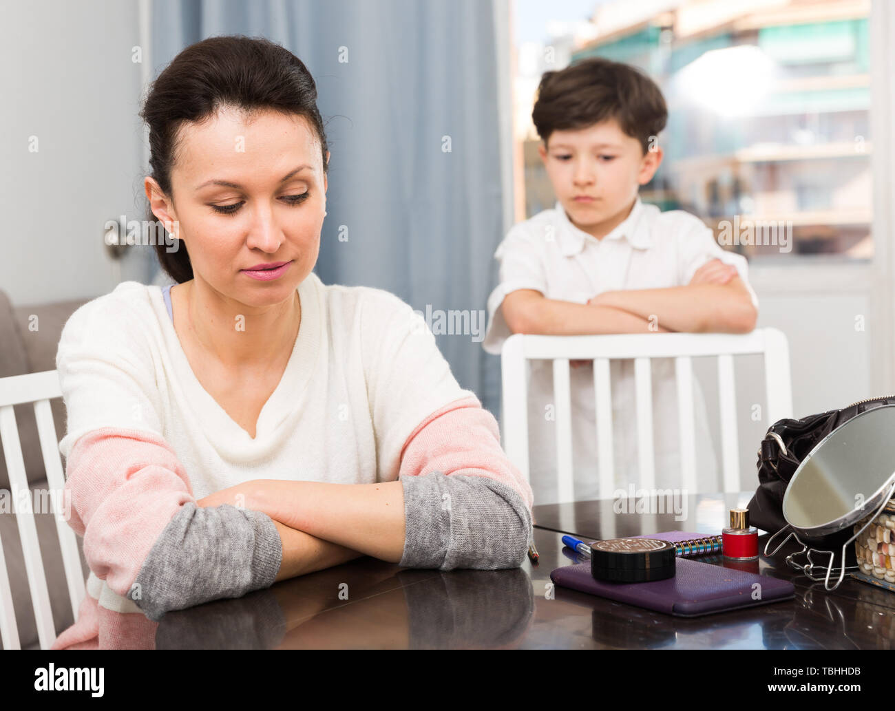 Portrait of offended mother after disagreements with preteen son ...
