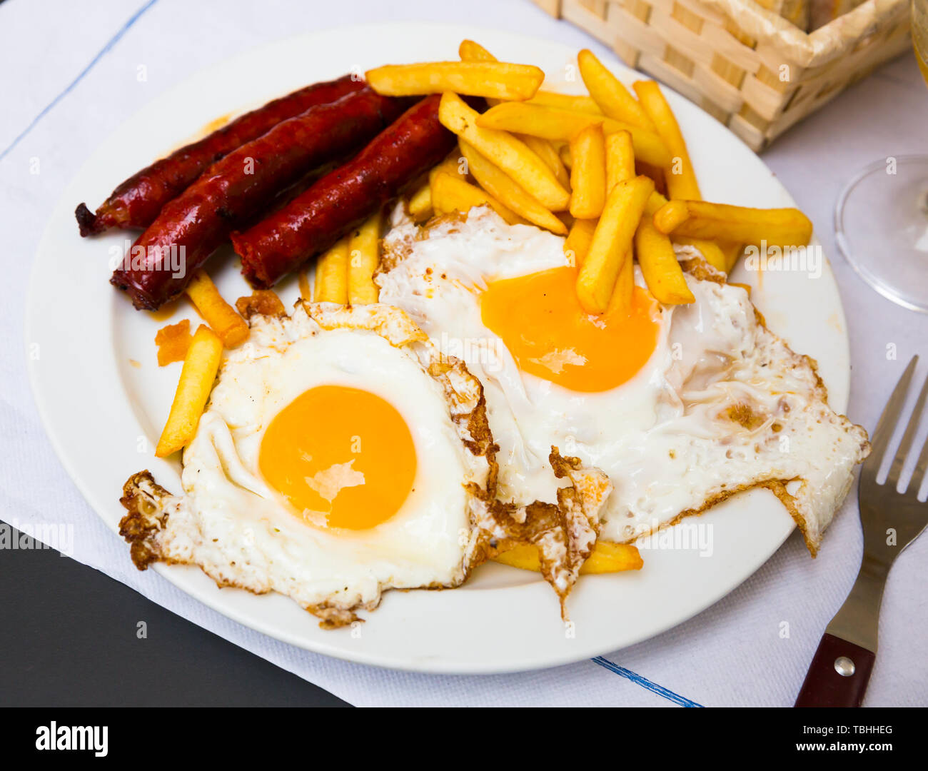Huevos con chistorra. Scrambled eggs with sausage and potatoes. Spanish ...