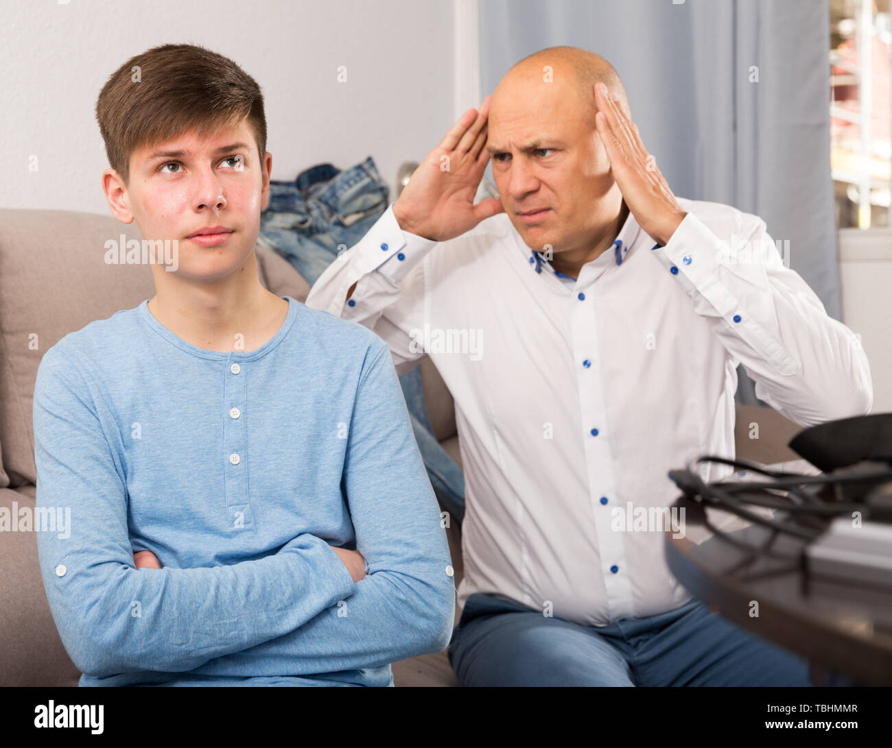 Portrait of angry father quarreling with his teenage son Stock Photo ...