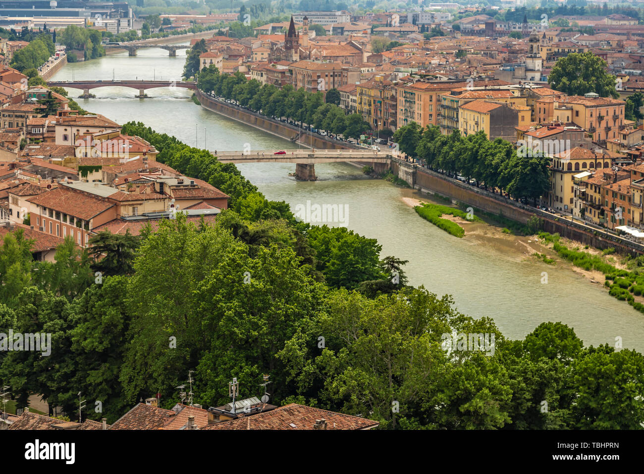 Amazing panorama of the Adige River running along ancient buildings of ...
