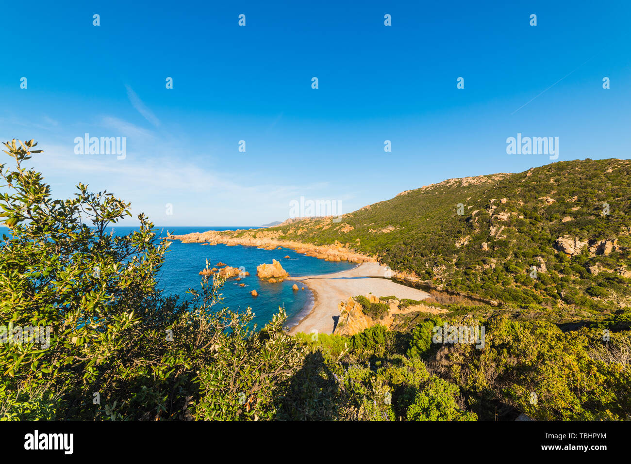 Tinnari beach under a blue sky. Sardinia, Italy Stock Photo - Alamy