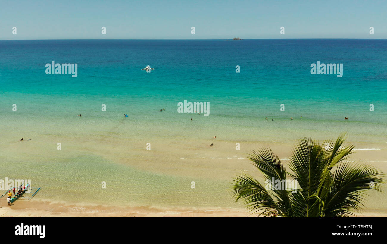 Beautiful tropical beach in cove with blue lagoon and turquoise water ...