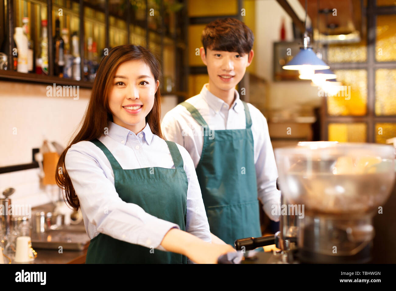 Make it waitress and waiter in cafe Stock Photo - Alamy