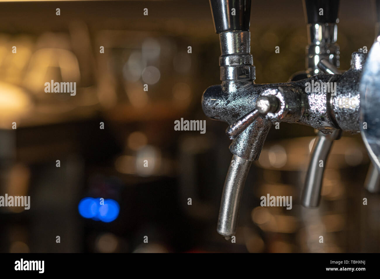 Pub Interior With Taps of Draft Beer. Taps of draft beer inside a ...