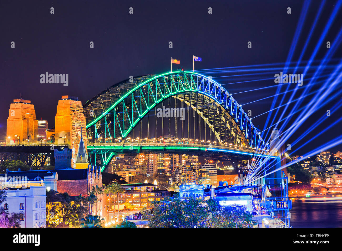 Steel arch of the Sydney Harbour bridge with bright illumination and ...