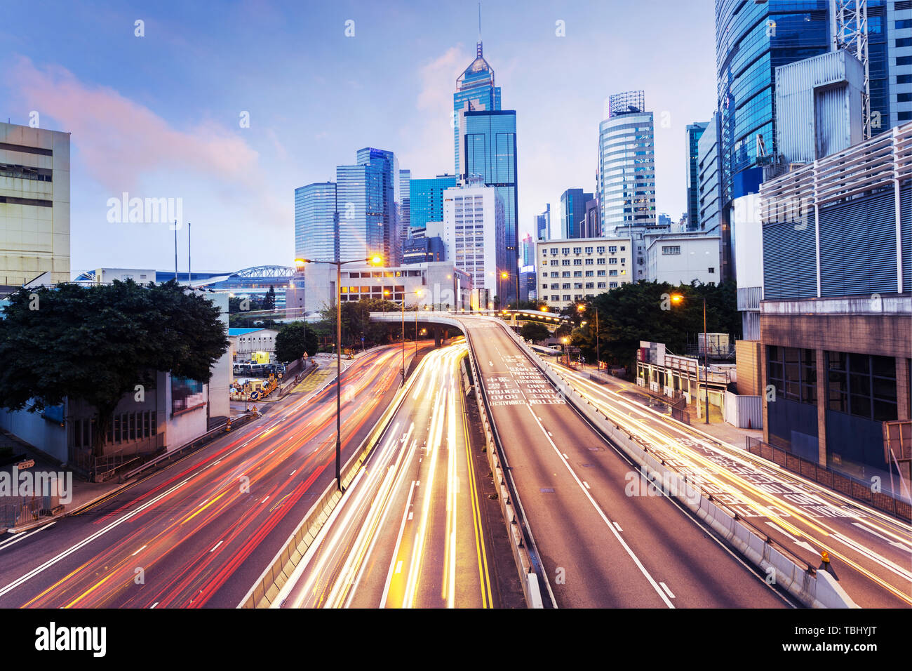 modern urban city traffic trails with cityscape background Stock Photo ...