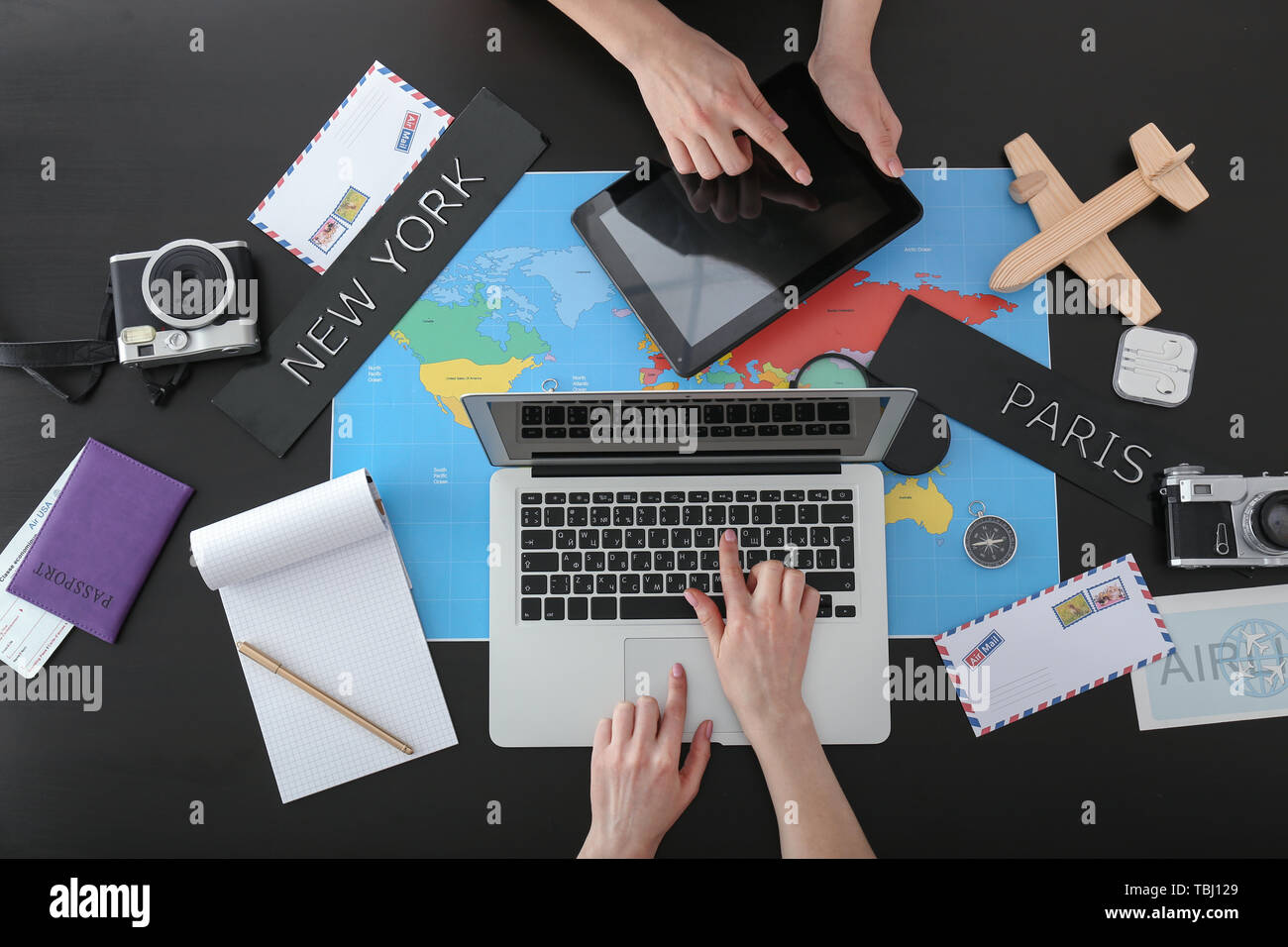 Travel agents choosing tour for client in office, top view Stock Photo ...