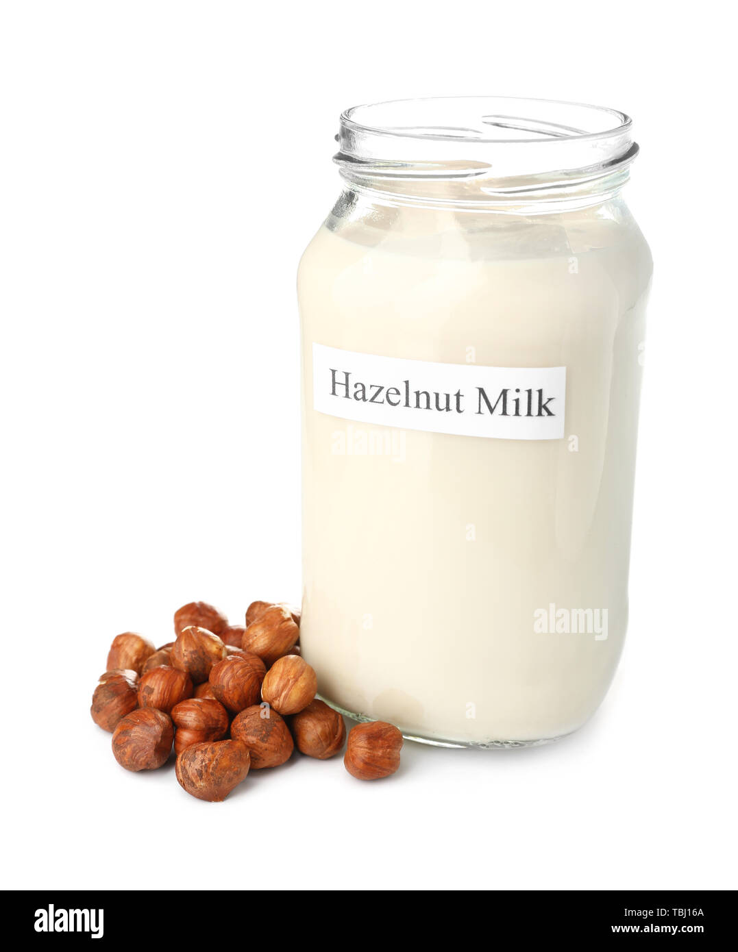 Jar of hazelnut milk on white background Stock Photo - Alamy