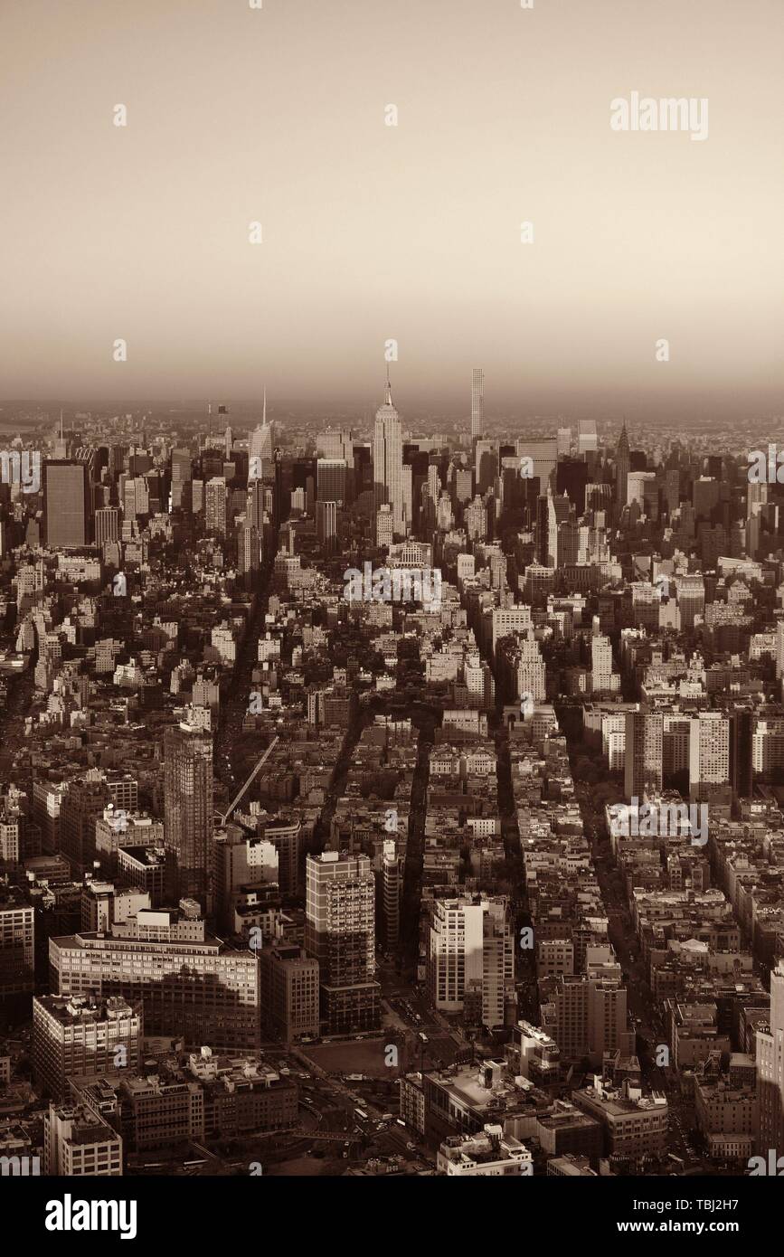 Manhattan midtown sunset rooftop view with urban skyscrapers in New ...