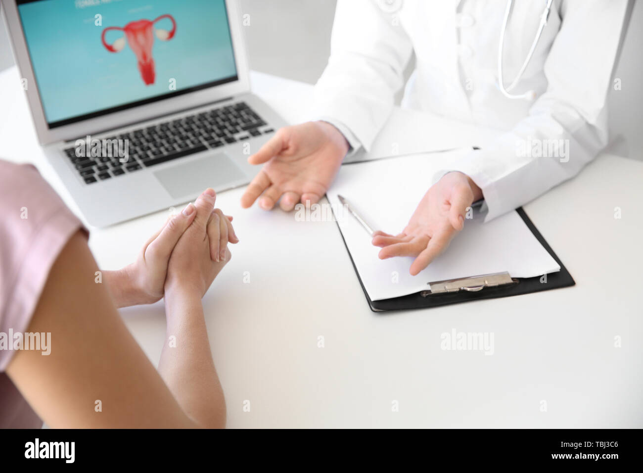 Gynecologist working with patient in office Stock Photo - Alamy