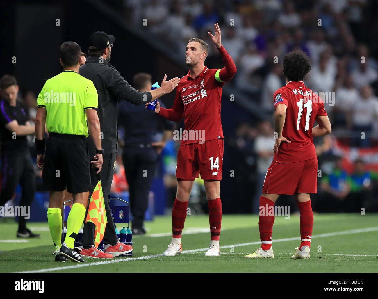 Liverpool's Jordan Henderson speaks with manager Jurgen Klopp during the UEFA Champions League ...