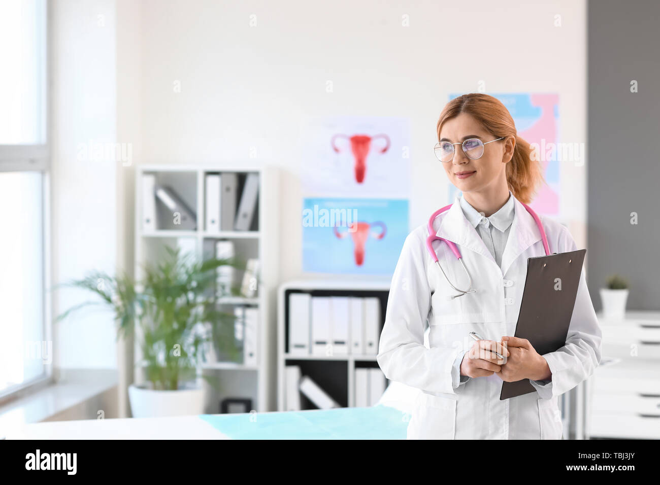Portrait of beautiful gynecologist in her office Stock Photo - Alamy