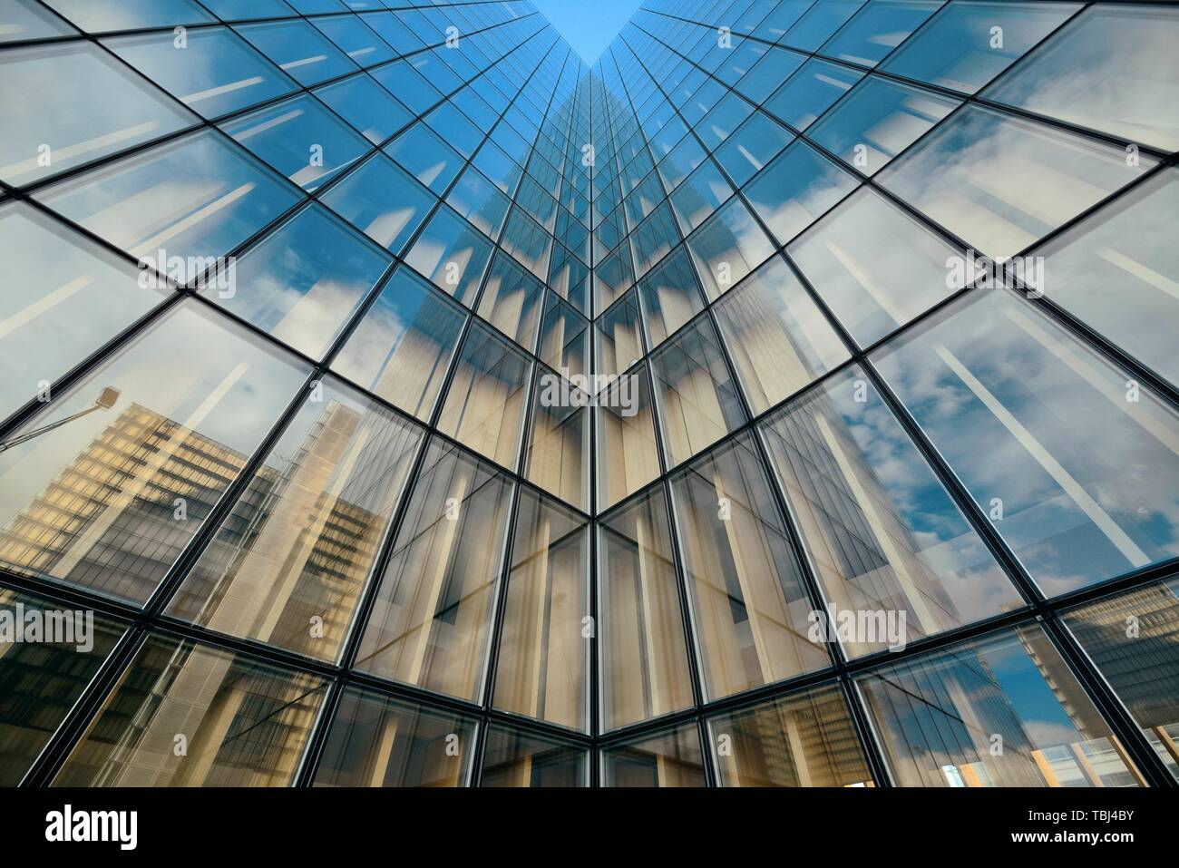 Glass reflection of skyscraper in Paris Stock Photo - Alamy