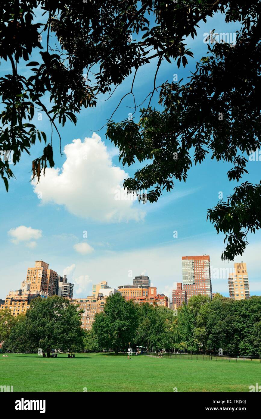 Central Park Spring with skyline in midtown Manhattan New York City ...