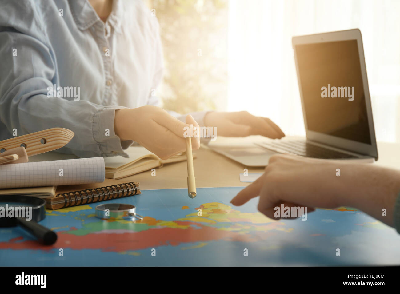 Business people discussing world map hi-res stock photography and ...