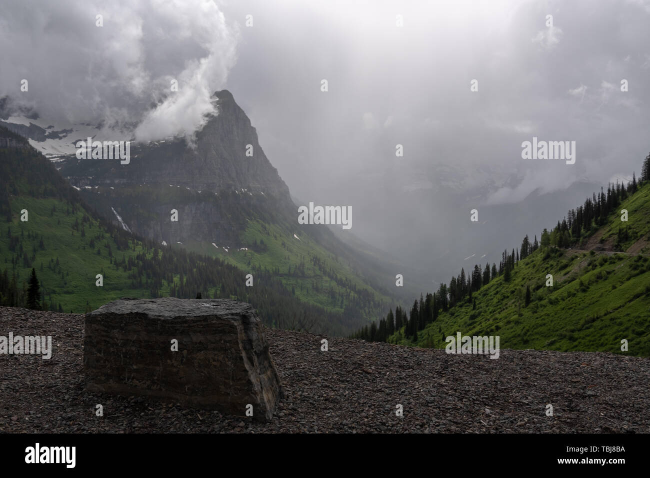 Rain Clouds Engulf Valley below Logan pass in Montana Stock Photo - Alamy