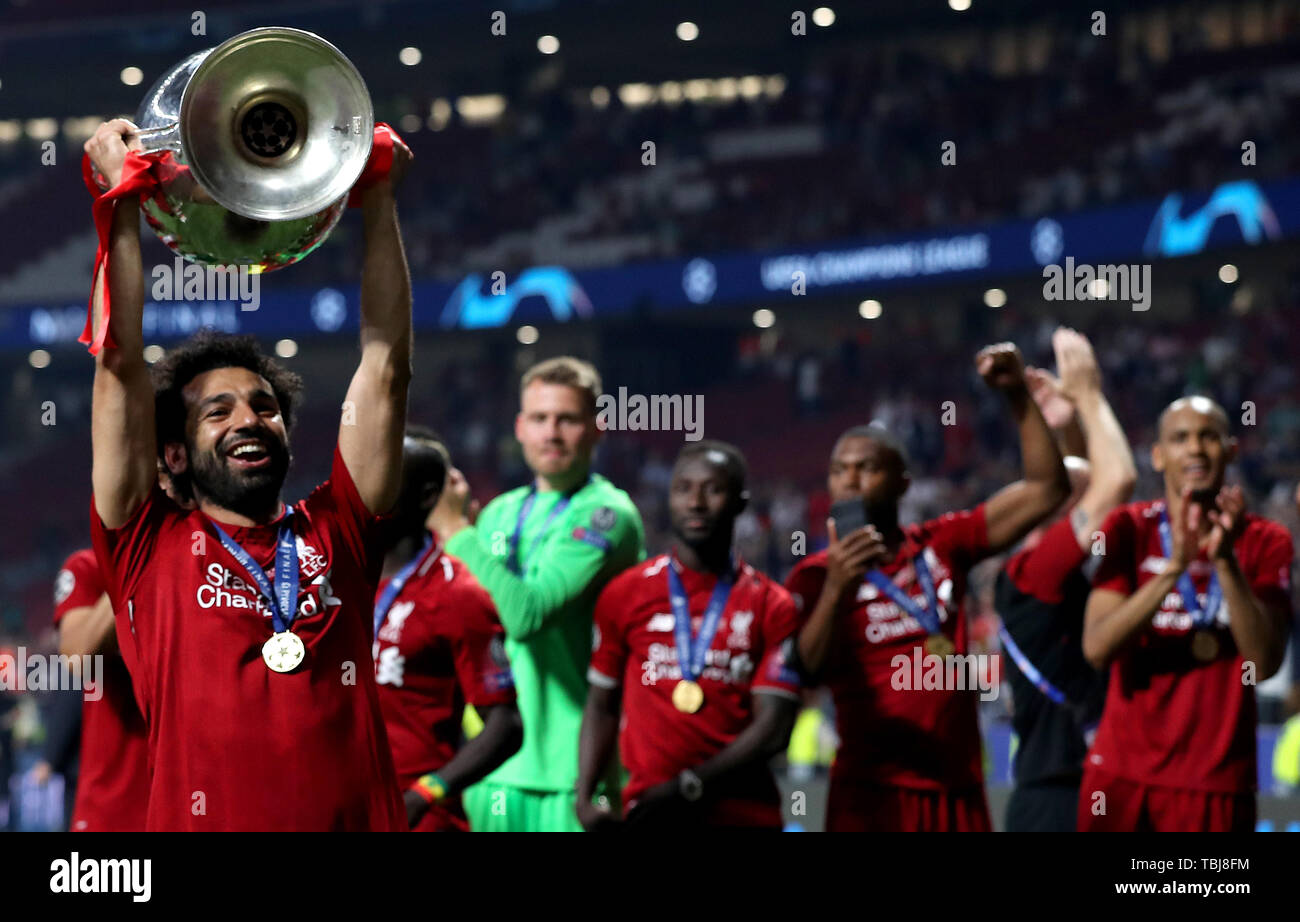 Liverpool's Mohamed Salah celebrates with the trophy after the UEFA ...