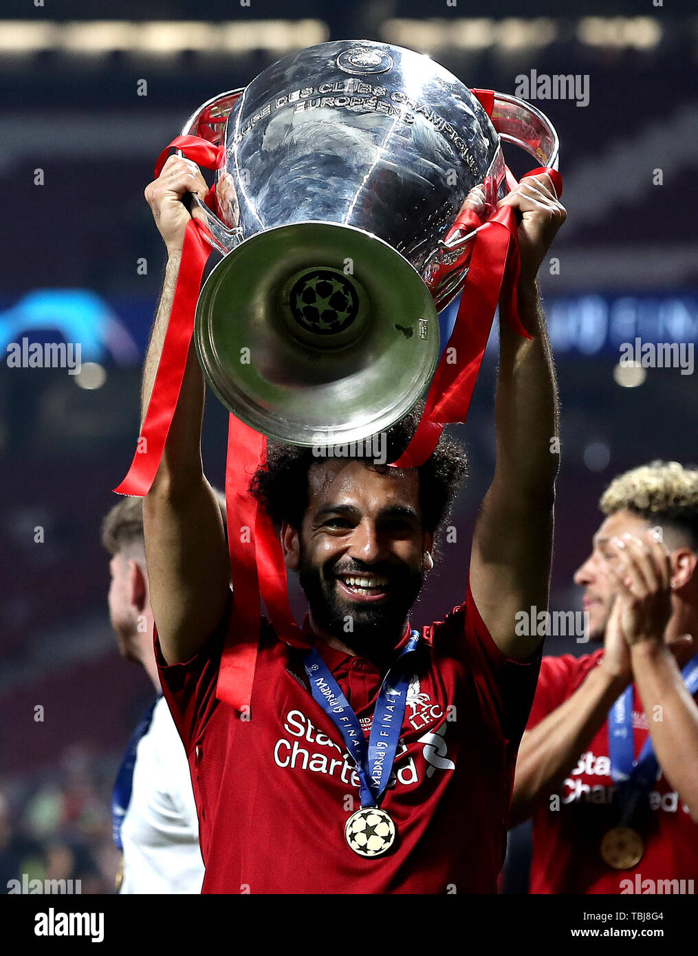 Liverpool's Mohamed Salah celebrates with the trophy after the UEFA ...