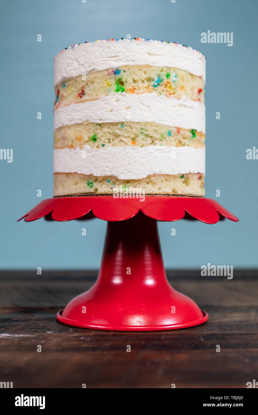 Red Cake Stand and Funfetti Cake on Blue Background vertical Stock ...