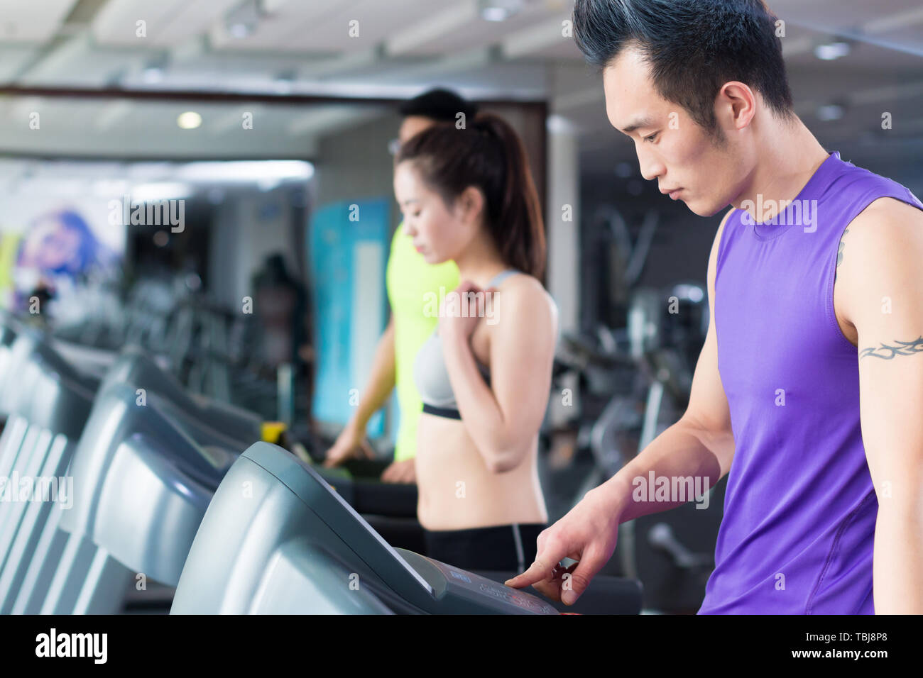 young asian people working out in modern gym Stock Photo - Alamy