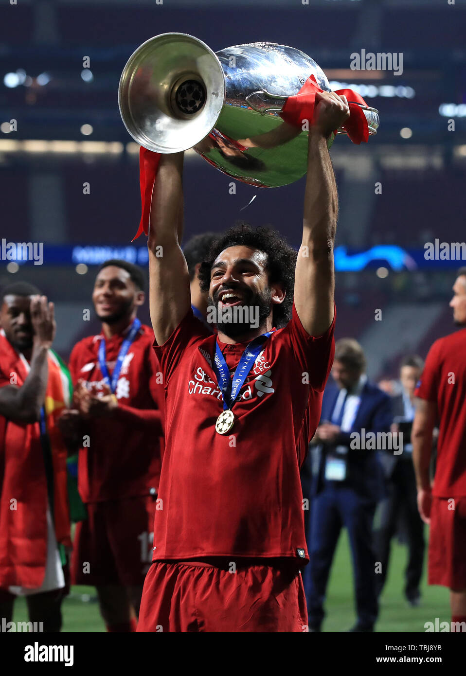 Liverpool's Mohamed Salah celebrates with the trophy after winning the ...