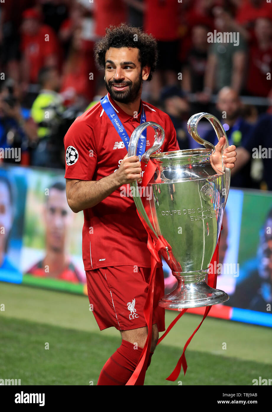 Liverpool's Mohamed Salah celebrates with the trophy after winning the ...