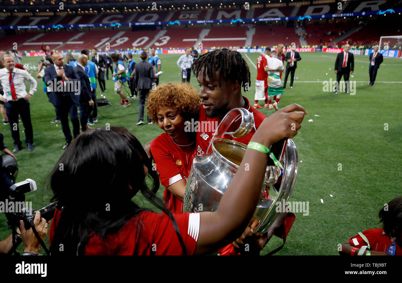 Liverpool's Divock Origi (right) celebrates with the trophy after the ...