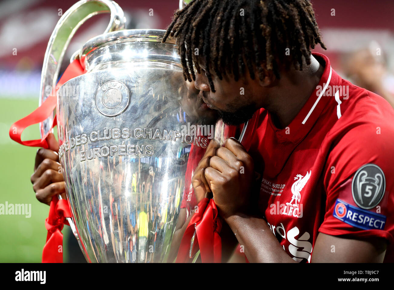 Liverpool's Divock Origi celebrates with the trophy after the UEFA ...