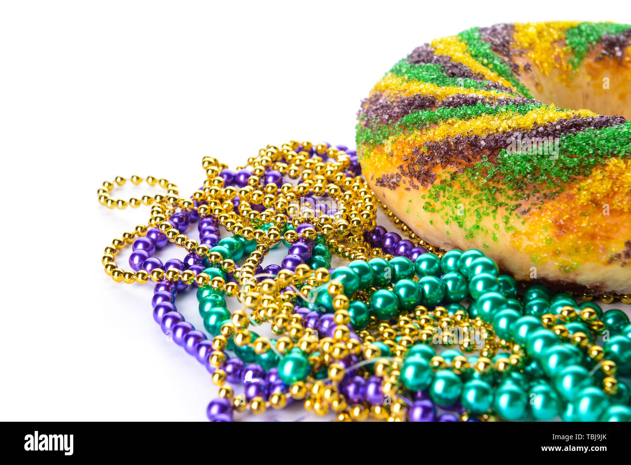 Festive cake for Mardi Gras (Fat Tuesday) holiday with beads on white ...