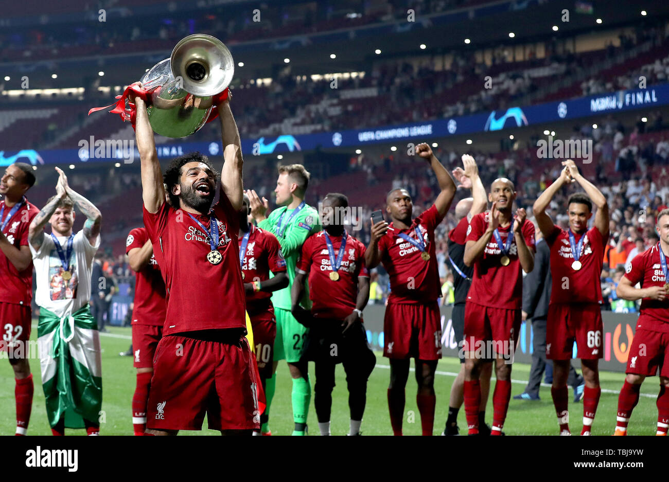 Liverpool's Mohamed Salah celebrates with the trophy after the UEFA ...