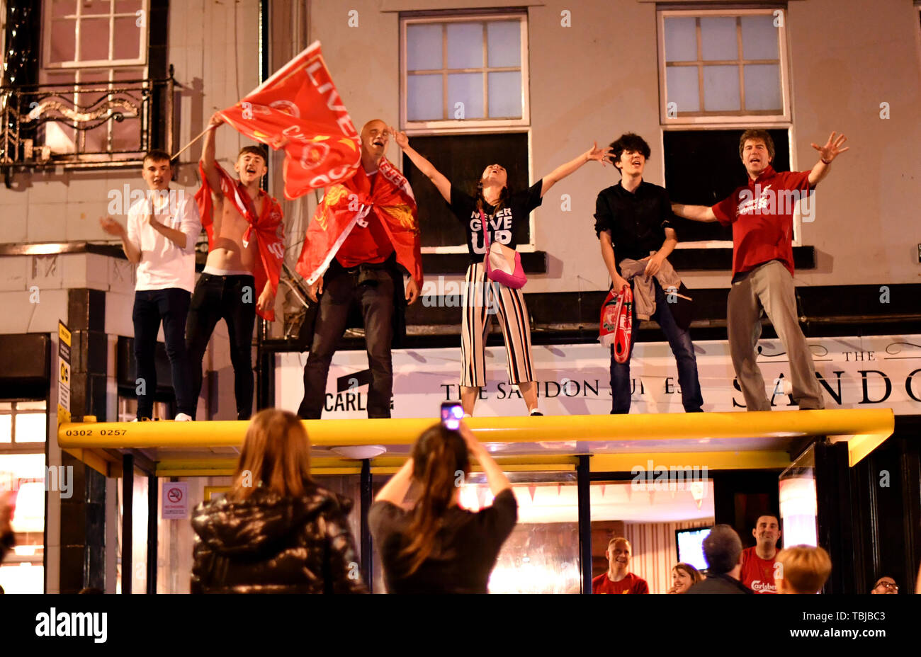 Liverpool fans celebrate their sides victory over Tottenham Hotspur's ...