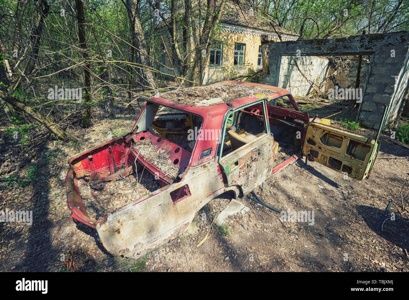 Radioactive dead zone of Chernobyl. Abandoned looted appliances, cars ...