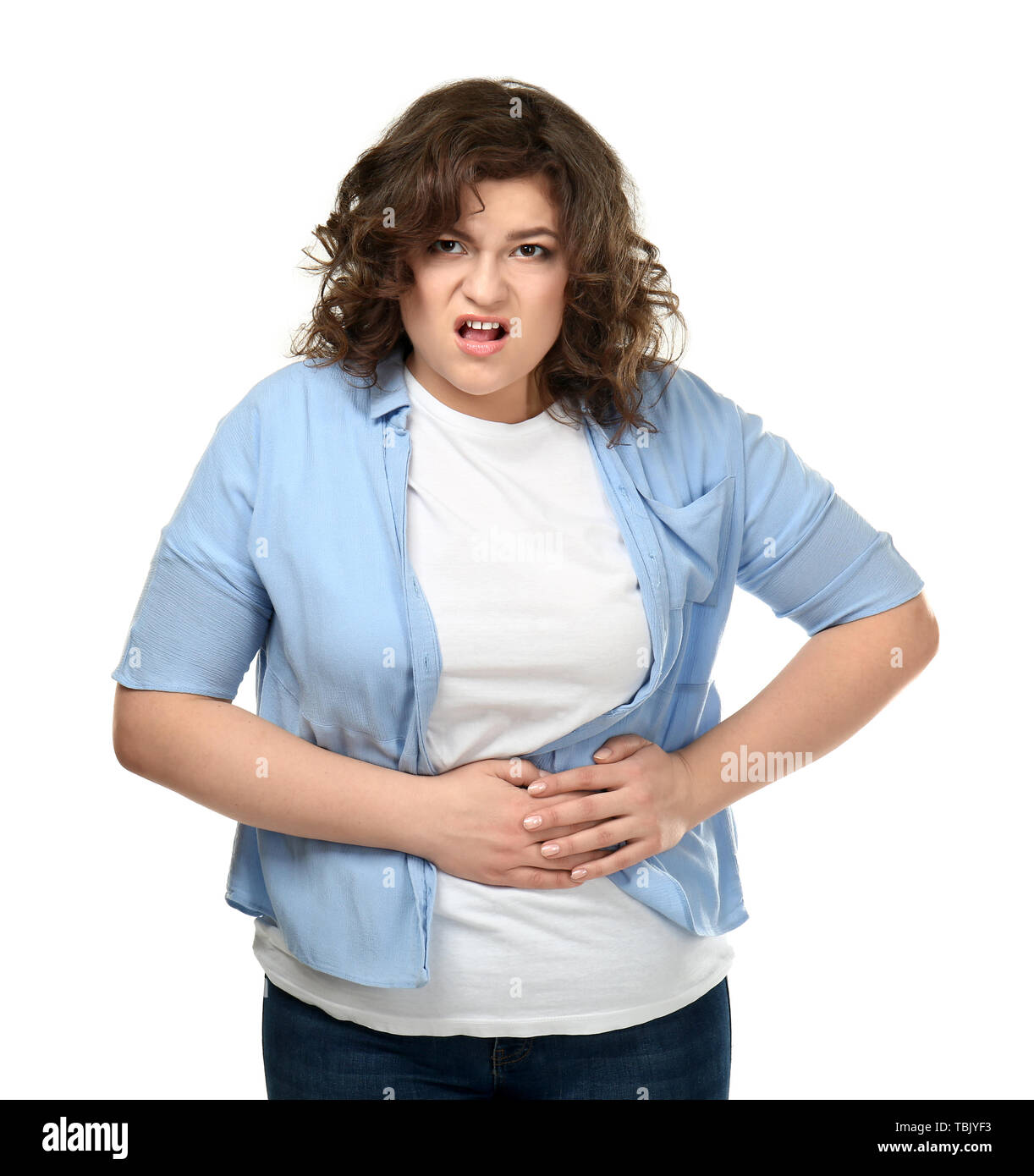 Overweight woman suffering from abdominal pain on white background ...