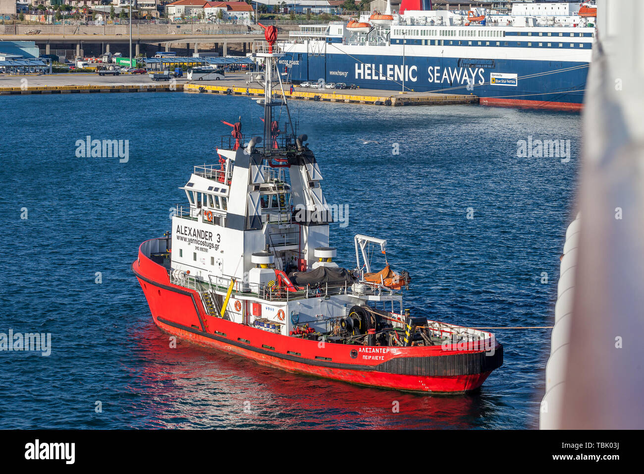 Tugboat dragging a cruise ship in the port of Piraeus, Athens Stock ...
