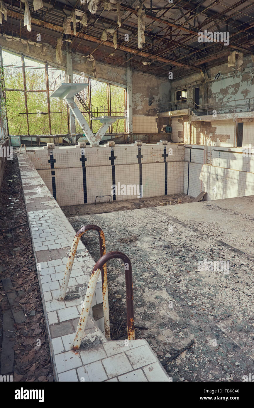 Abandoned swimming pool in Pripyat. Destroyed gym in a radioactive city ...