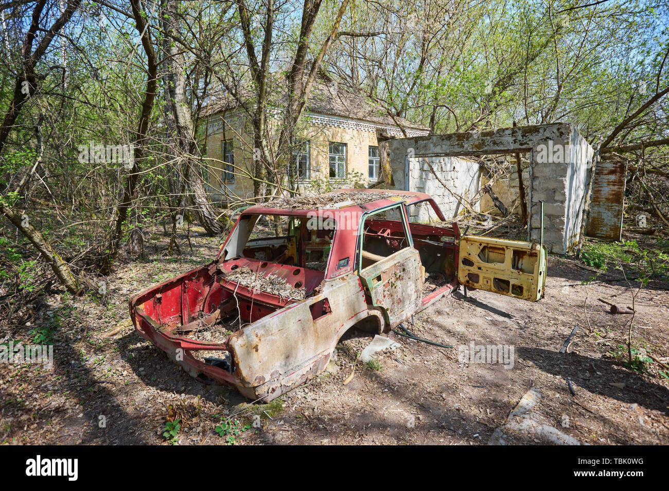 Radioactive dead zone of Chernobyl. Abandoned looted appliances, cars ...