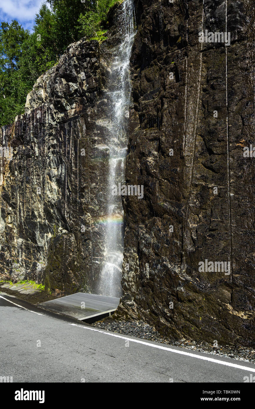 Waterfall with a small rainbow on the road to Geirangerfjordnear Eagle ...