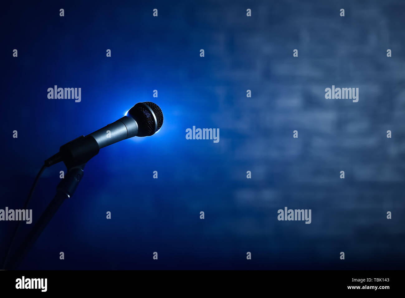 Modern microphone in smoke on stage Stock Photo - Alamy