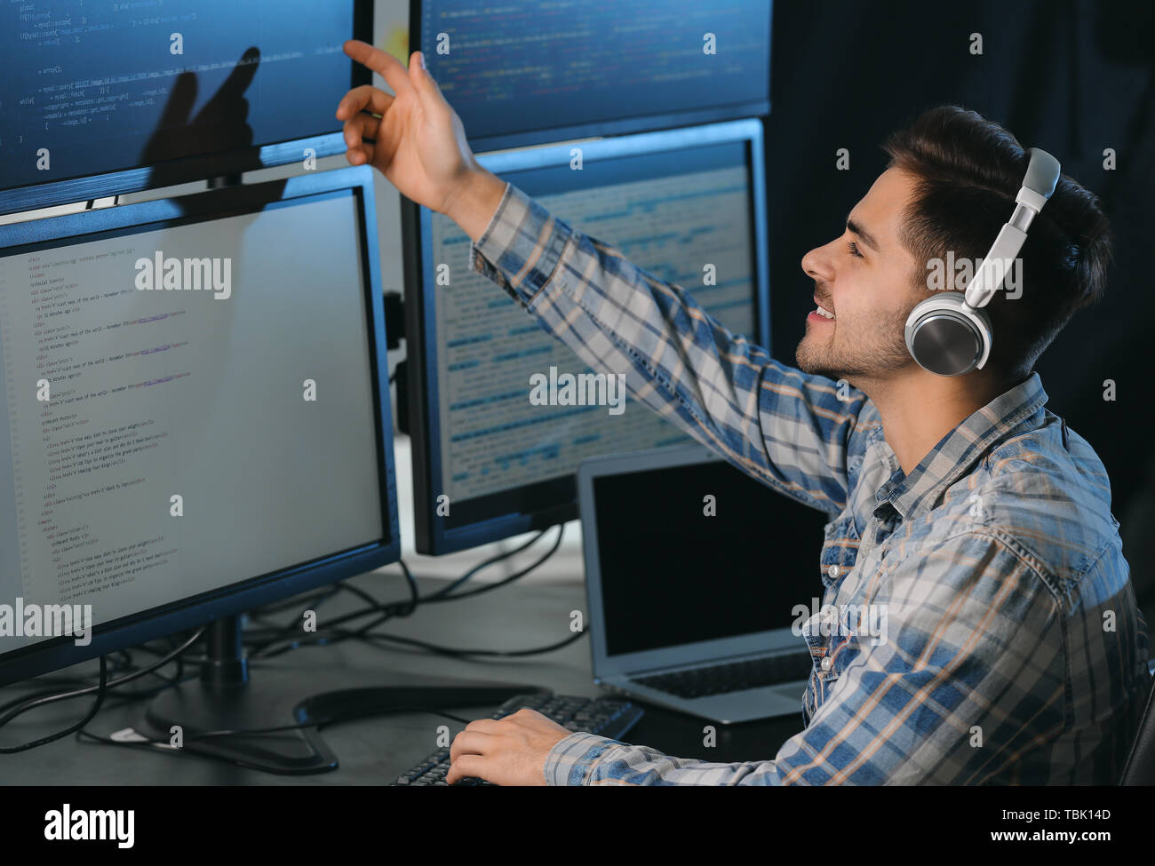 Male programmer working in office Stock Photo - Alamy
