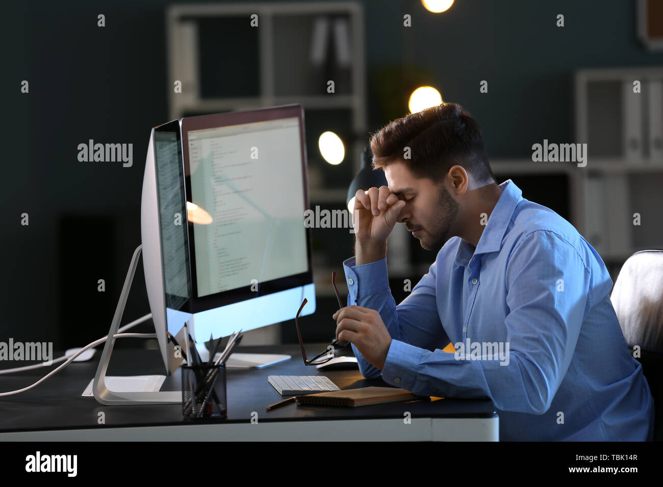 Portrait young tired programmer hi-res stock photography and images - Alamy