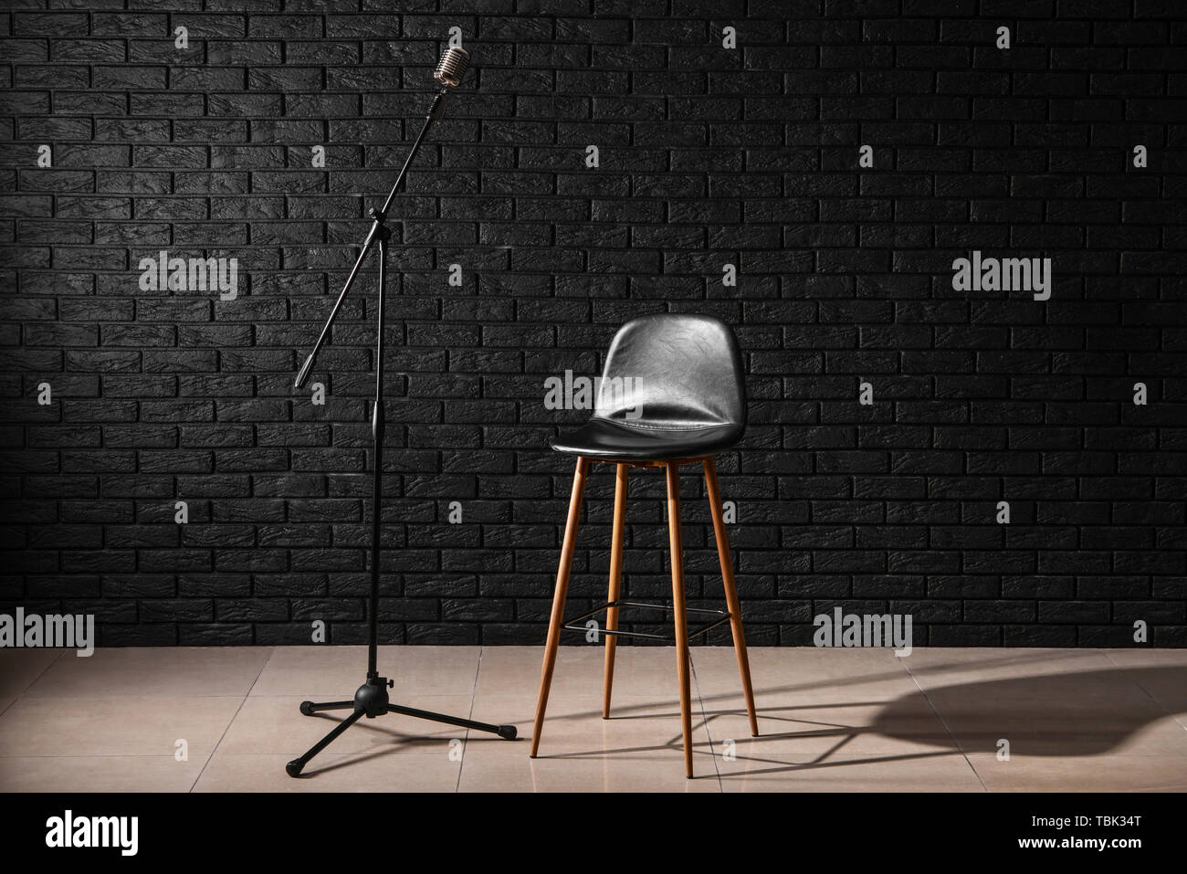 Microphone with chair in studio Stock Photo - Alamy